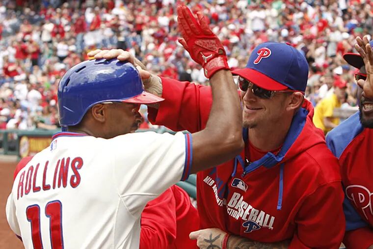 Rollins begins homer barrage as Phils rout Reds again