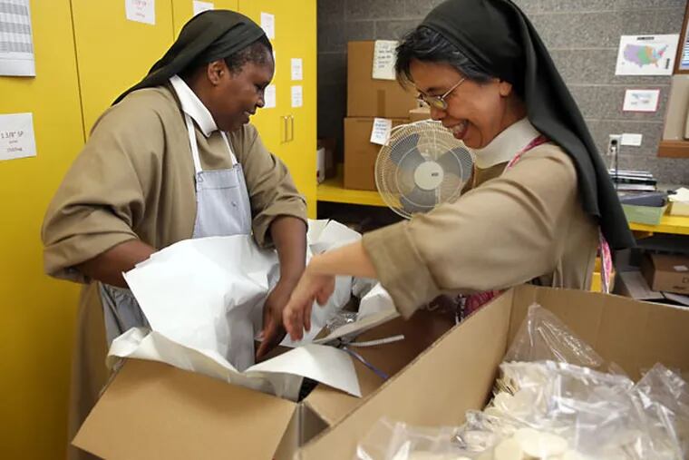 Local cloistered nuns make communion wafers for papal Mass