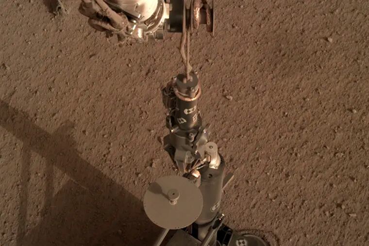 Mars lander starts digging on red planet, hits snags