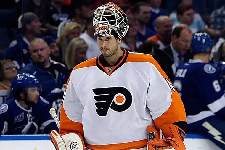 Flyers and Michael Leighton are lit up by Lightning
