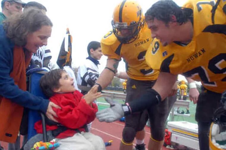 Rowan football team taps ailing boy's spirit