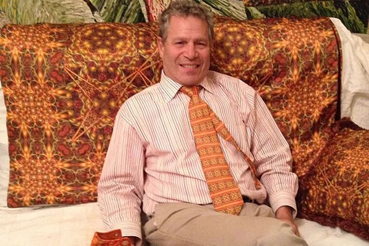 He translates his artwork into wearable silk accessories