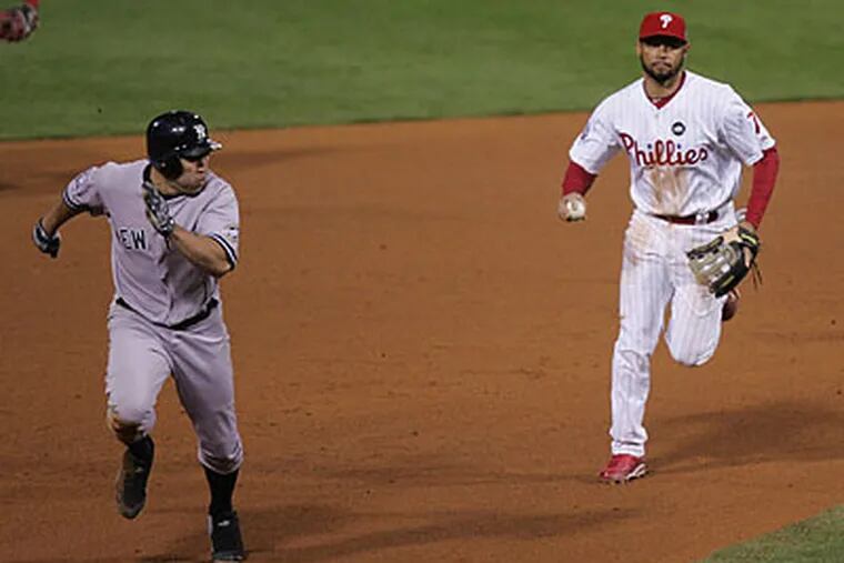 Phils' Lidge works on holding runners on first